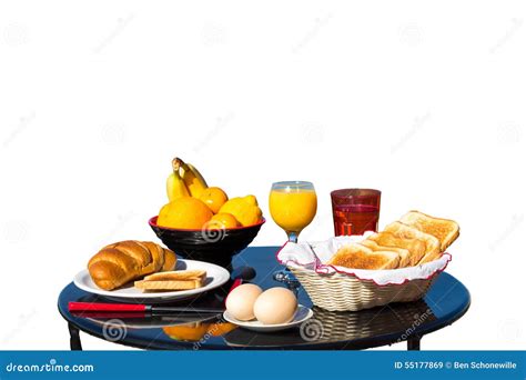 Таблица с едой как завтрак на белизне Стоковое Изображение изображение насчитывающей сок еда