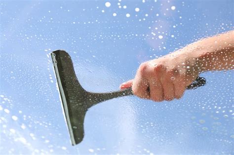 Woman Washing Window With Squeegee Tool Against Blue Sky Closeup Stock Image Image Of
