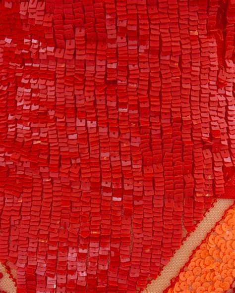 Premium Photo A Red And Orange Fabric With A Small Red Square Cut Out