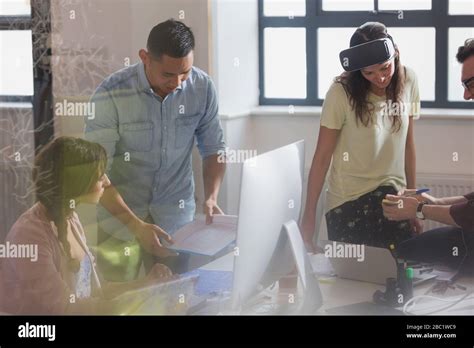computer programmers programming virtual reality simulator glasses in