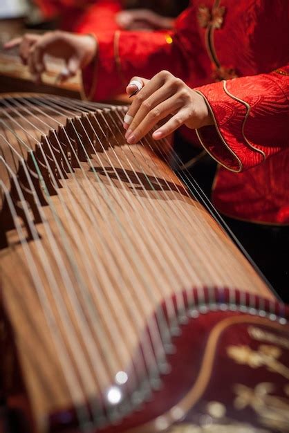 Premium Photo Midsection Of Woman Playing String Instrument