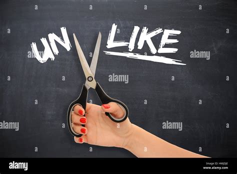 Woman Transforming The Word Unlike To The Word Like By Cutting The Prefix With Scissors