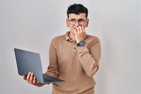 Non Binary Person Using Computer Laptop Looking Stressed And Nervous