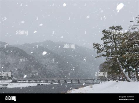 A Photo Shows Arashiyama And Togetsukyo Bridge Covered In Snow In Kyoto