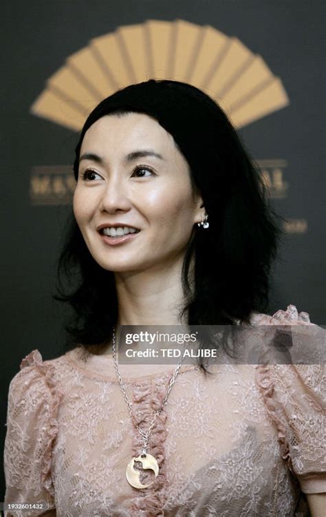 Hong Kong Actress Maggie Cheung Poses For A Photo During The News