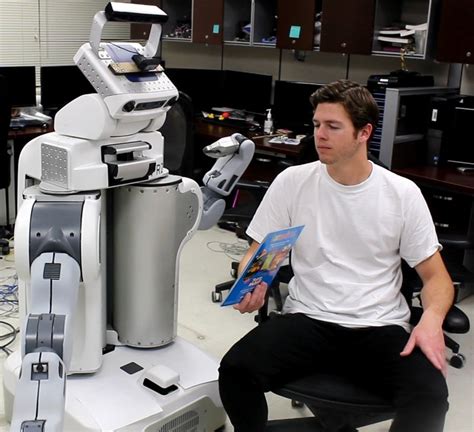 Robot Grasping An Object From A Tripod Left Initial Position Of The