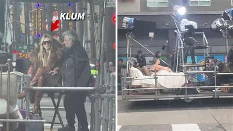 Heidi Klum Looks On While Models Pose In Underwear On Flatbed Truck