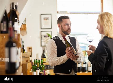 Professional Sommelier Tasting Wine In Restaurant Hi Res Stock