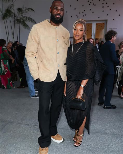 Lebron James In Louis Vuitton And Savannah James In Issey Miyake At The