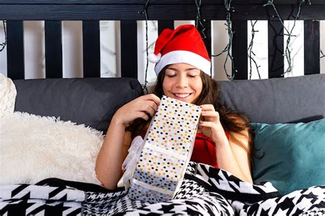 Premium Photo Portrait Of Happy Girl Lying On Bed At Home