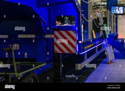 The Rear Of A Large Truck With A Low Bed Platform Designed For