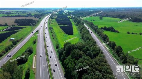 Aerial view on the A7 motorway in northern Germany between fields and ...