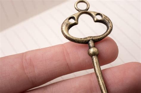 Premium Photo Close Up Of Human Hand Holding Key