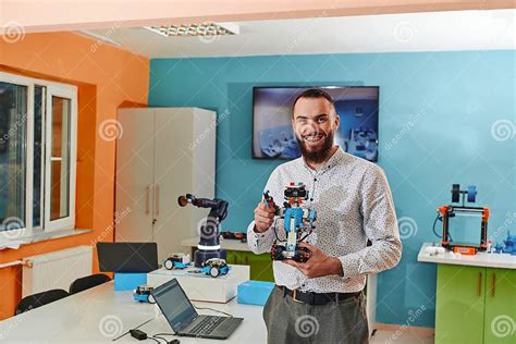A Man Working In A Robotics Laboratory Focusing On The Intricate Fields Of Robotics And 3d
