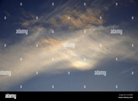 a tangent arc over a near setting sun in summer westland new zealand