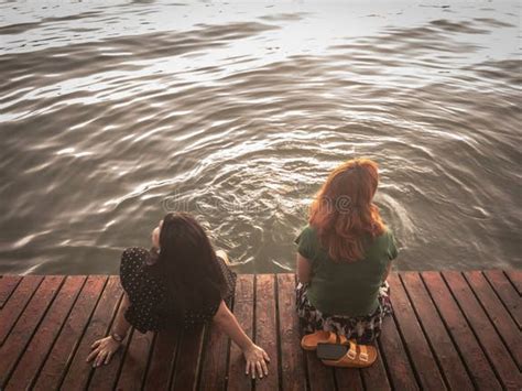 Selective Blur On Two Young Serbian Women Girls Relaxing By The Sava