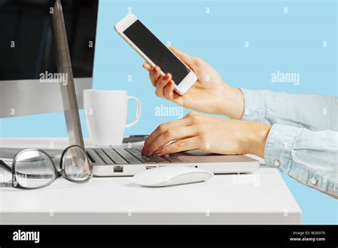 Young Woman Sitting At The Table With Open Netbook Computer Female