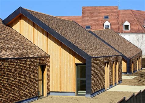 Brown Ceramic Shingles Cover Nomade Architects Village Like Nursery