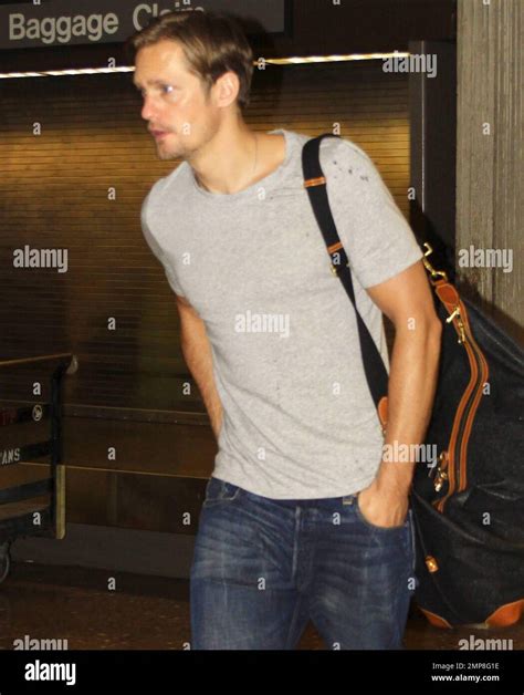 swedish actor alexander skarsgard carries a duffle bag upon arrival at