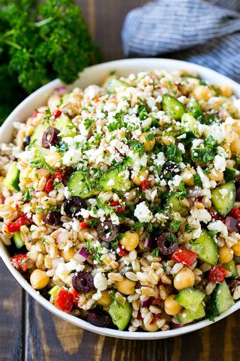 Farro Salad Made With Cuucmber Feta Cheese Olives And Peppers Topped