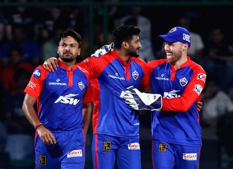 Dcs Bowler Mukesh Kumar With Teammates Celebrate The Dismissal Of Rcb