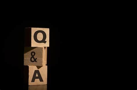 Premium Photo Wooden Blocks Written With Qa Business Concept