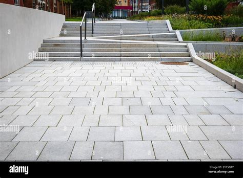 Tiled Pedestrian Pathway With Steps Within Urban Surroundings Stock
