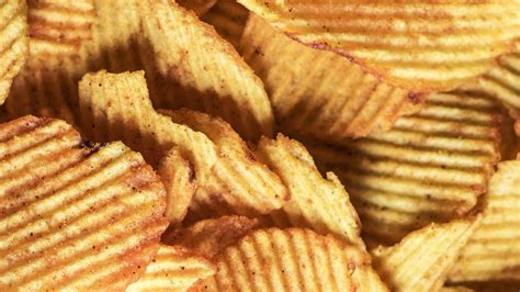 A Bunch Of Golden Chips Rotates In A Circle Golden Potato Chips Are
