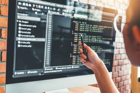 Premium Photo | Developing programmer reading computer codes development website design and ...