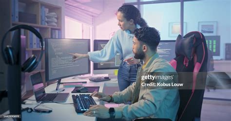 Programmer Coding And Team Talking About Software Data On Computer For Cybersecurity Programming