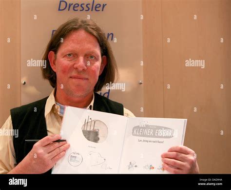 Dutch Illustrator And Author Hans De Beer Signs His Book Kleiner