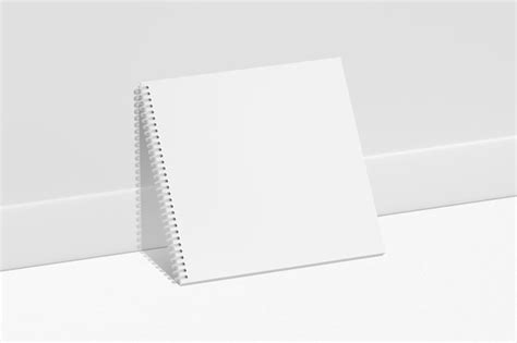 Premium Photo A White Spiral Notebook On A White Surface
