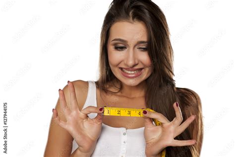 Babe Woman Makes Fun Of The Length Of Measuring Tape Stock Photo Adobe Stock