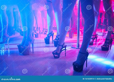 Young Woman Pole Dancing Striptease With Pylon In Night Club Beautiful