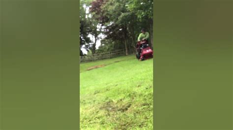 Stand on lawnmower wheelie and slide down bank fail. Ferris z1 36 ...