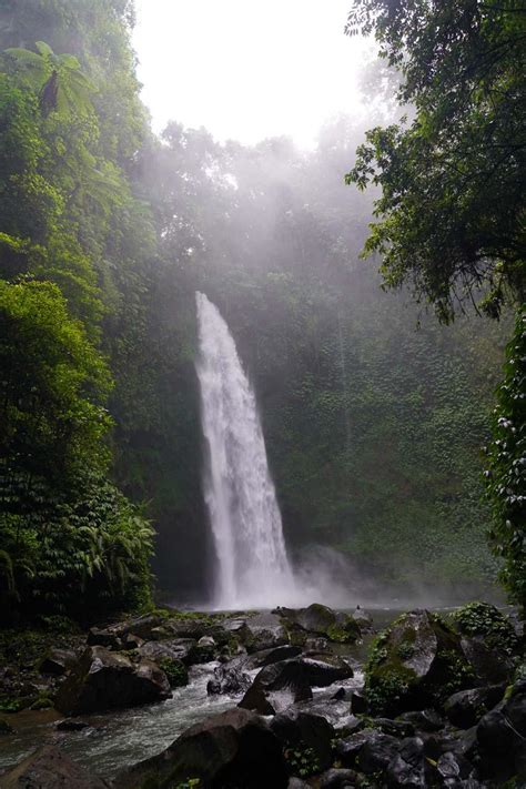 Nungnung Waterfall Many Steps To A Gushing Tall Waterfall