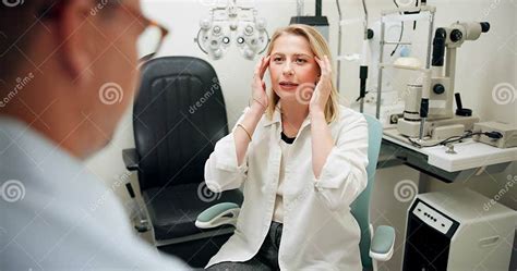 Hospital Doctor And Woman In Consultation Eye Exam And Explaining To