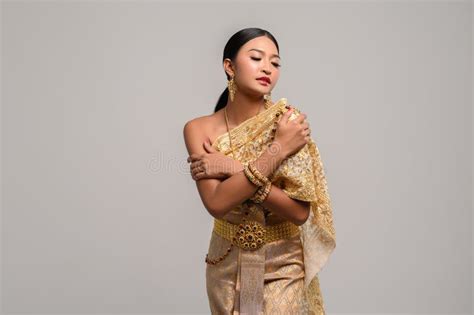 Beautiful Women Wear Thai Clothes And Stand To Hug Their Breasts Stock
