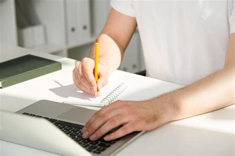 Premium Photo Man Using Notebook And Writing