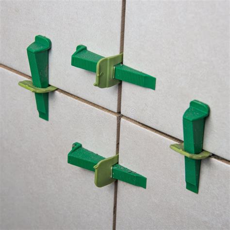 Tile Leveling System With Plastic Clips And Wedges Shot While The Tile