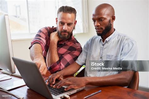 Two Developers Peer Programming Together In Office Coding Side By Side