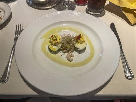 A Refined Presentation Of Seafood Deviled Eggs Garnished With Sprouts