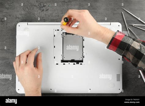 Male Hands Assembling Laptop Body On Table Concept Of Computer Repair Stock Photo Alamy