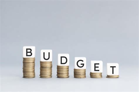 Premium Photo Constraint Budget Concept Pile Of Coins Forming A