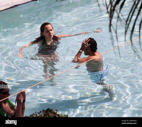 Exclusive French Actor Jamel Debbouze And Wife Melissa Theuriau Kiss And Cuddle In The Pool At
