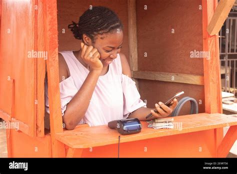 An African Lady Making Use Of Her Pos Machine Stock Photo Alamy