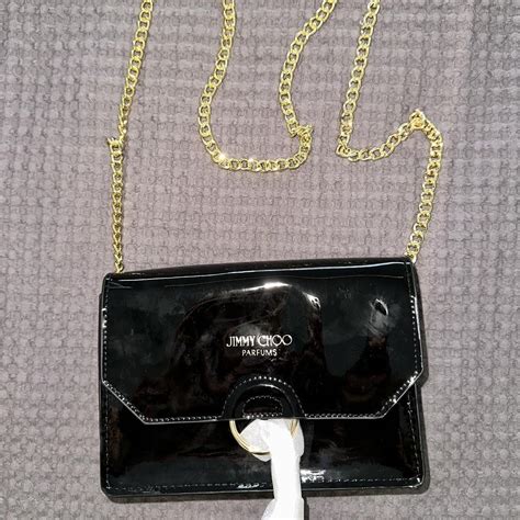 Jimmy Choo Parfums black & gold handbag - Depop