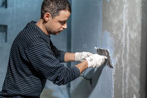 Manual Application Of Waterproofing To The Wall On The Construction
