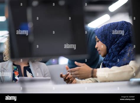 Black Muslim Female Software Developer Working Together With Her Black Muslim Female Software Developer Working Together With Her