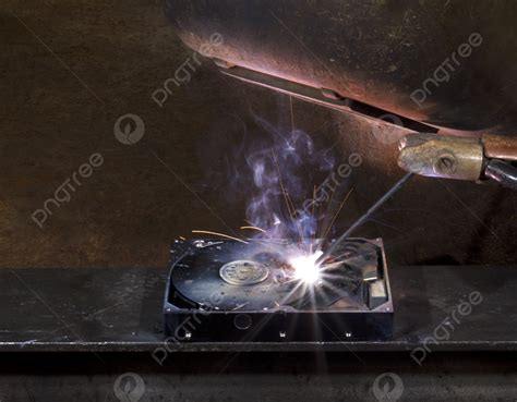 Fixing A Faulty Hard Disk With A Welding Tool Photo Background And Picture For Free Download